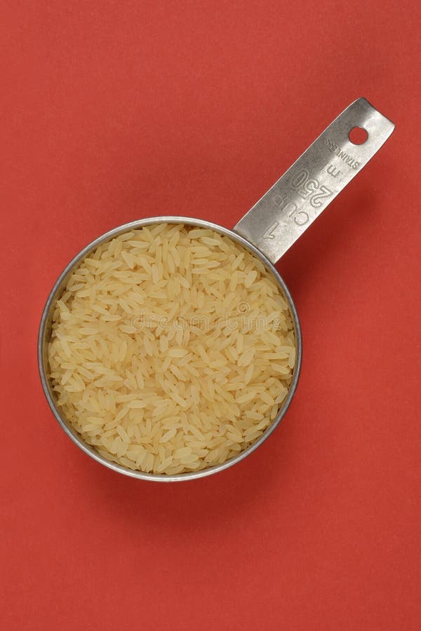 Measuring Cup Filled with Rice Stock Photo - Image of filled ...