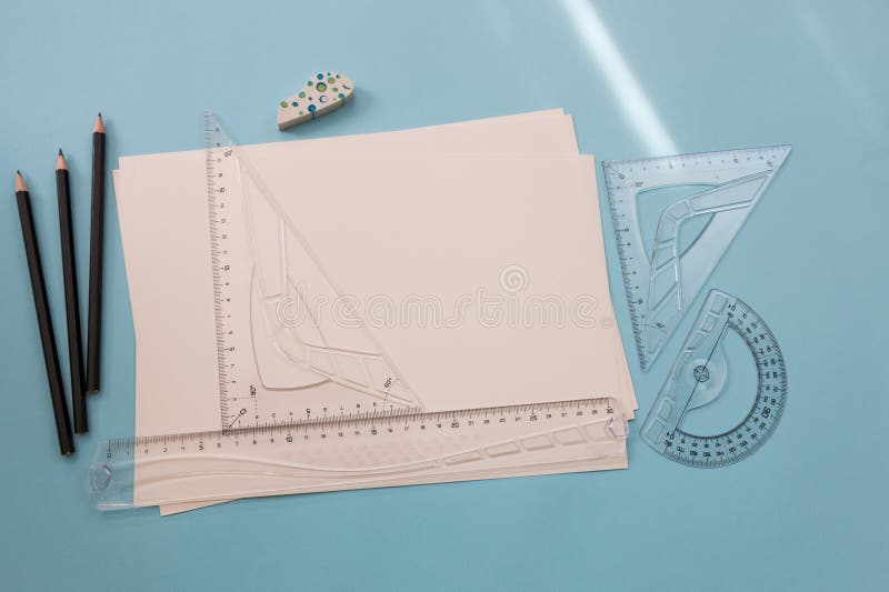 Measuring and Drawing Tools. a Sheet of White Paper, Pencils, Rulers on ...