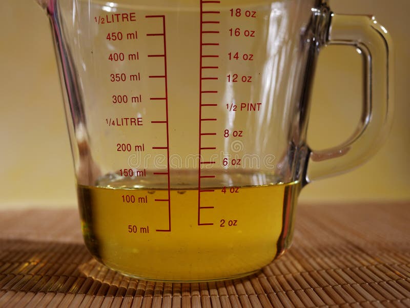 Measuring Glass Jug with Vegetable Oil Medium Shot Stock Image - Image ...