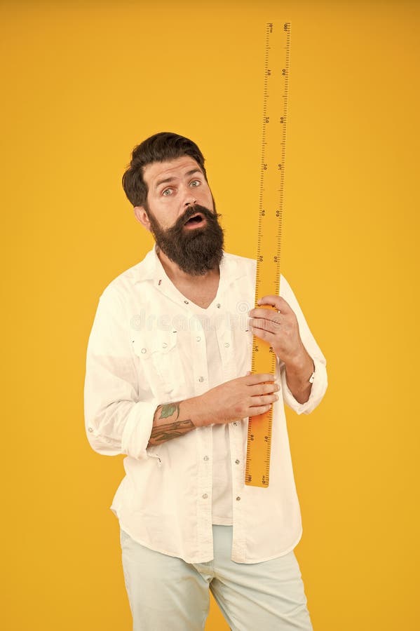 Measuring Length at Geometry. Bearded Man Holding Ruler for Geometry ...