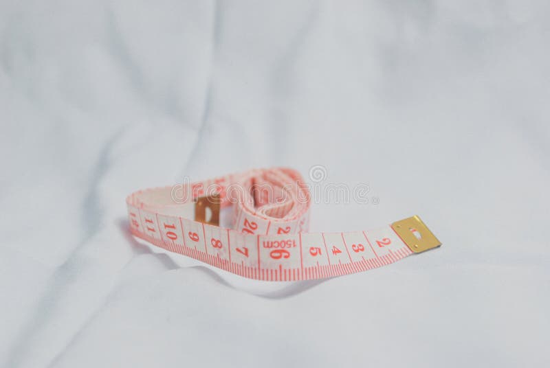 Measuring Lint with Red Numbers Stock Photo - Image of fashion, label ...