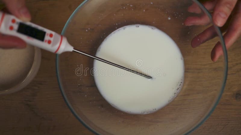 Measuring Milk Temperature with Digital Kitchen Thermometer Stock Video ...