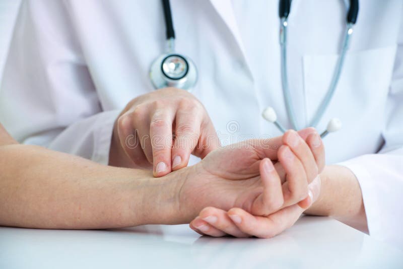 Measuring of Pulse on Wrist Stock Photo - Image of person, people: 33438124