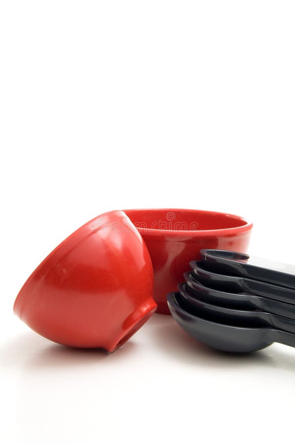 Measuring Red Cup and Black Measuring Spoons Stock Photo - Image of ...