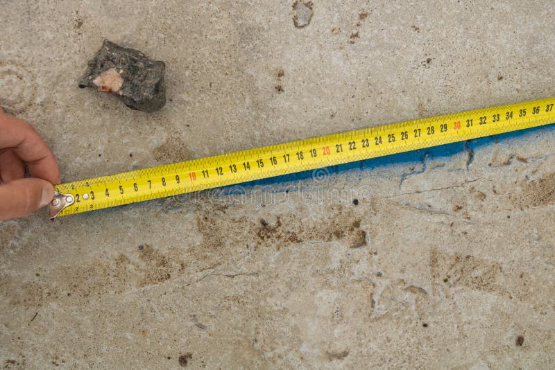 Measuring Ruler on a Concrete Wall Texture Stock Photo - Image of space ...