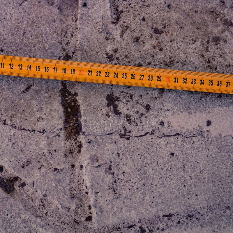 Measuring Ruler on a Concrete Wall Texture Stock Image - Image of ...