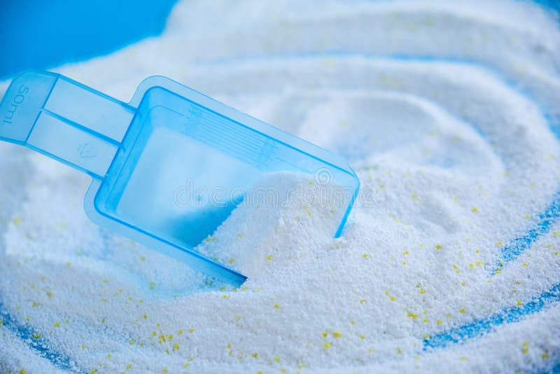 Measuring Scoop with Laundry Powder on Blue Background Stock Image ...