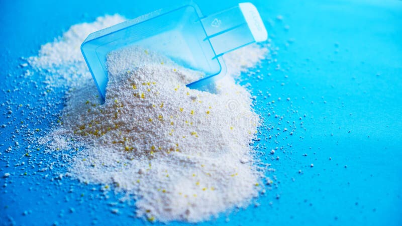 Measuring Scoop with Laundry Powder on Multi-colored Background Stock ...