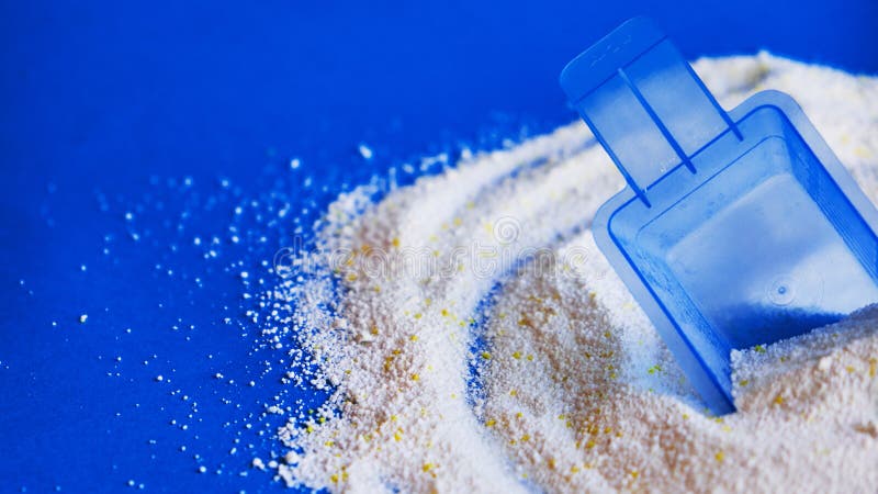 Measuring Scoop with Laundry Powder on Multi-colored Background Stock ...