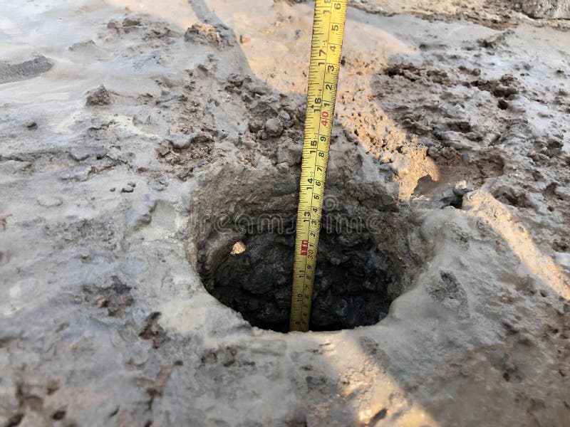 Measuring Soil Depth for Construction Foundation Stock Image - Image of ...