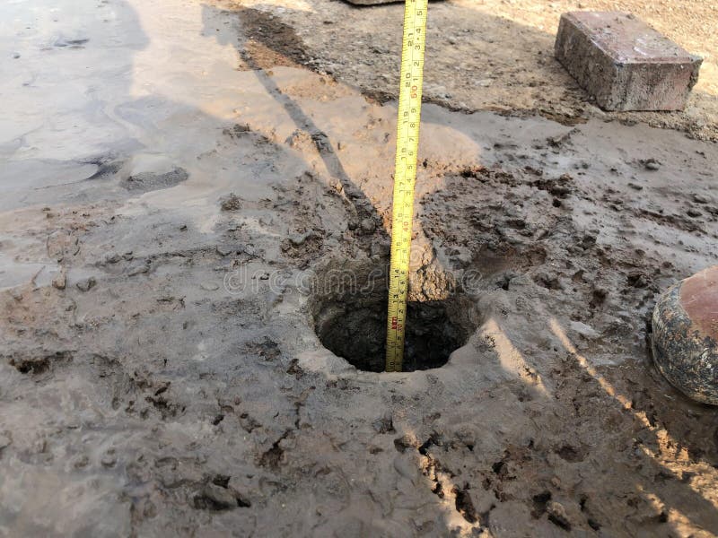 Measuring Soil Depth for Construction Foundation Stock Image - Image of ...