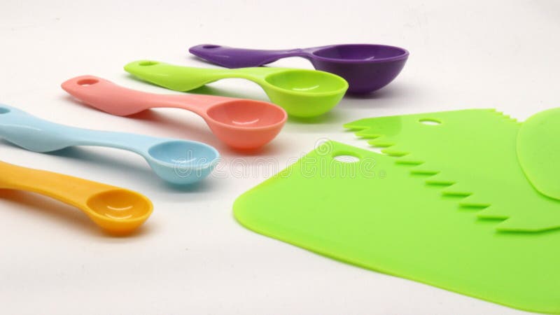 Measuring Spoons in Various Colors and Cake Dough Cutting Tool Stock ...