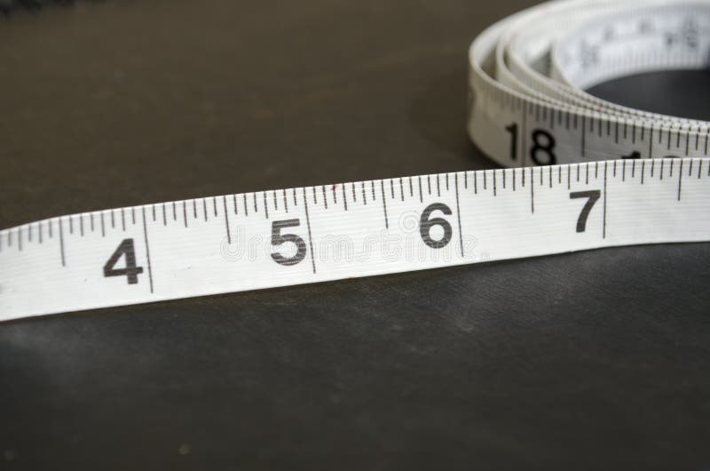 Measuring Tape on a Black Background Stock Photo - Image of background ...