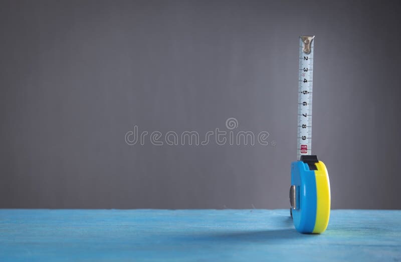 Measuring Tape on the Blue Table Stock Image - Image of table, meter ...
