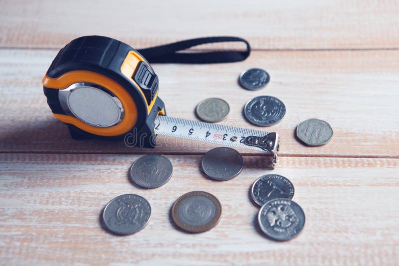 Measuring Tape and Coins on the Table Stock Image - Image of measuring ...