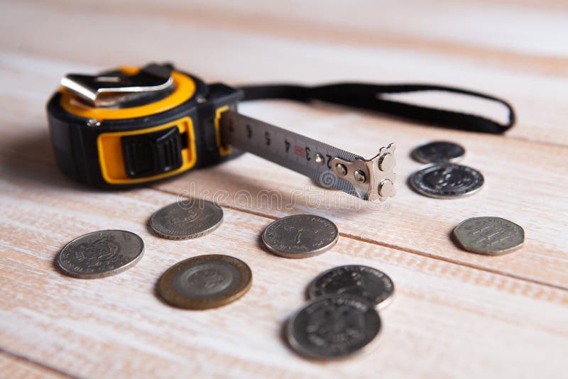 Measuring Tape and Coins on the Table Stock Photo - Image of ...