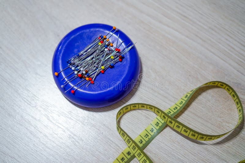 Measuring Tape and Colorful Pins in the Tailor Shop. Stock Photo ...