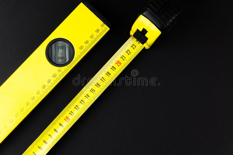 Measuring Tape and Construction Level in Yellow Stock Image - Image of ...