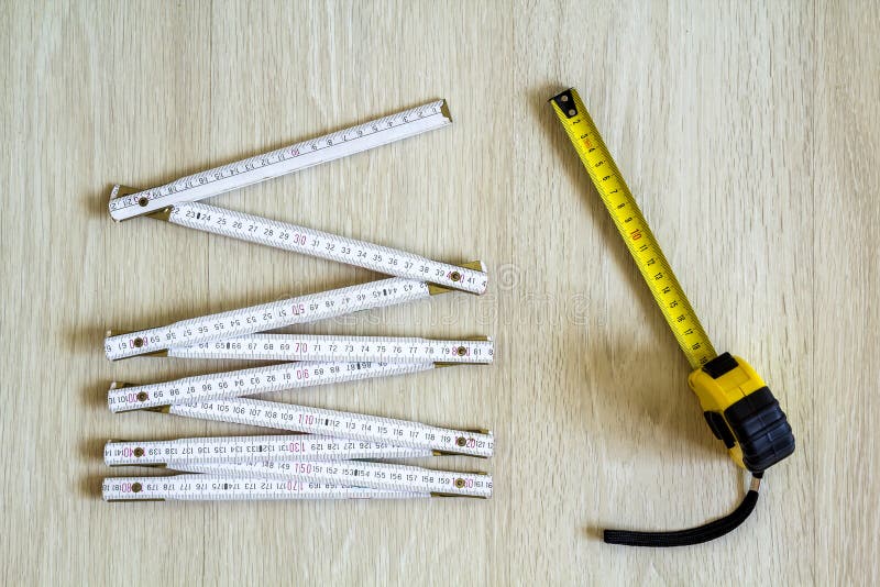 Measuring Tape and Meter on Wooden Background. Top View. Stock Image ...