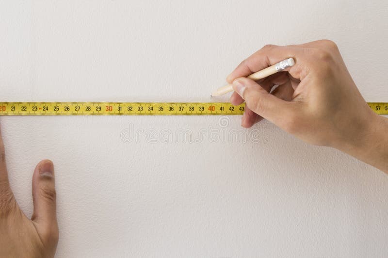 Measuring tape and pencil stock image. Image of hands - 30370073