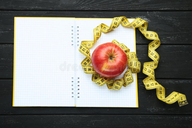 Measuring Tape with Apple and Notepad Stock Photo - Image of length ...