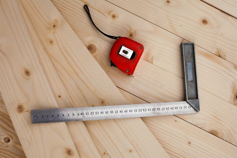 A Measuring Tape and a Square Stock Photo - Image of metal, industry ...