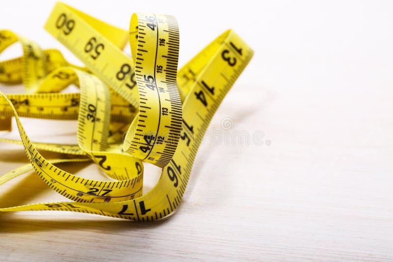Measuring tape on table stock photo. Image of work, yellow - 66048718