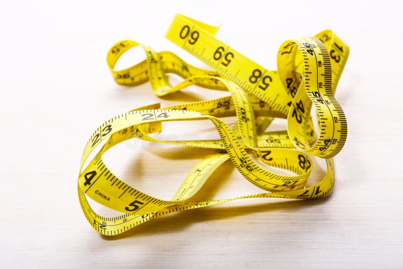 Measuring tape on table stock image. Image of inch, industry - 66048277