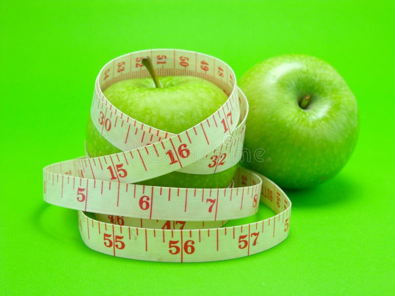 Measuring Tape Wrapped Around Apple Stock Image - Image of idea, meter ...
