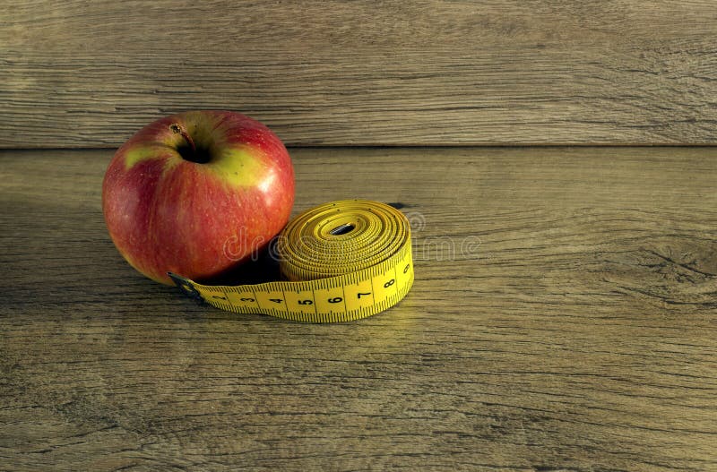 Measuring Tape Wrapped Around an Apple Stock Photo - Image of food ...