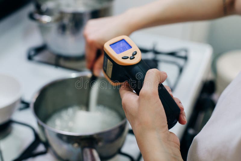 Measuring the Temperature of Water by Digital Thermometer Stock Image ...