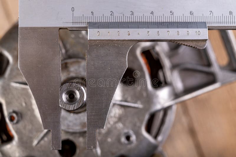 Measuring the Thread with an Analog Caliper. Measurement Work in the ...