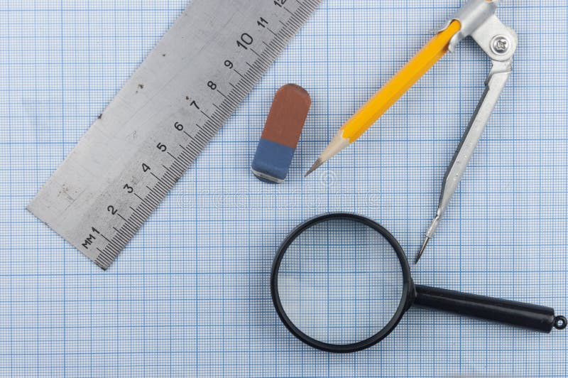 Measuring Tools Above Blue Graph Paper Stock Image - Image of equipment ...