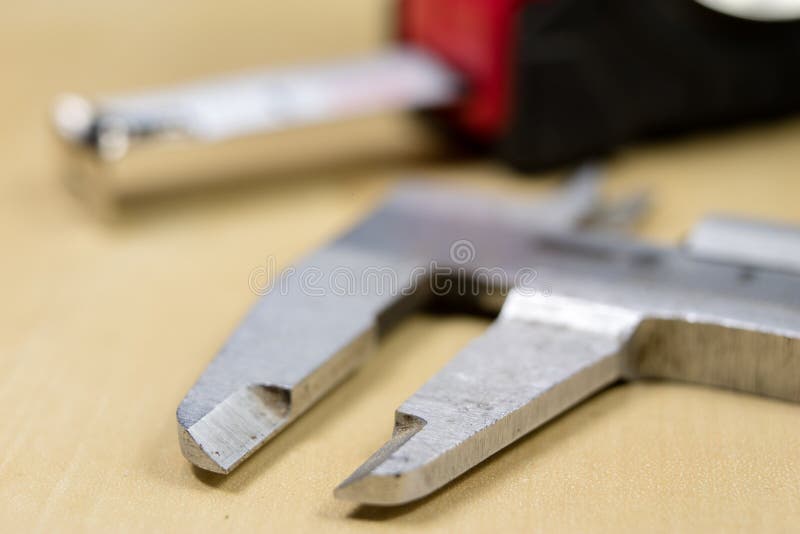 Measuring Tools in the Workshop. Caliper for Locksmith Work on a Stock ...