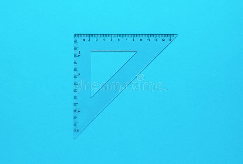 Measuring Transparent Triangle on a Light Blue Background Stock Photo ...