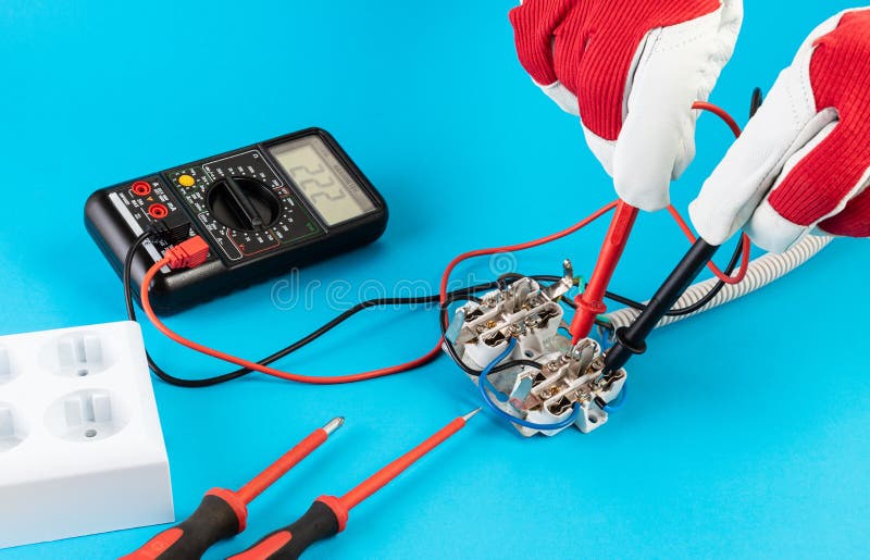 Measuring Voltage with a Multimeter at the Contacts of an Electrical ...