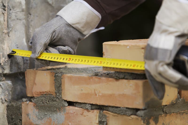 Measuring the Wall during Construction Stock Image - Image of measure ...