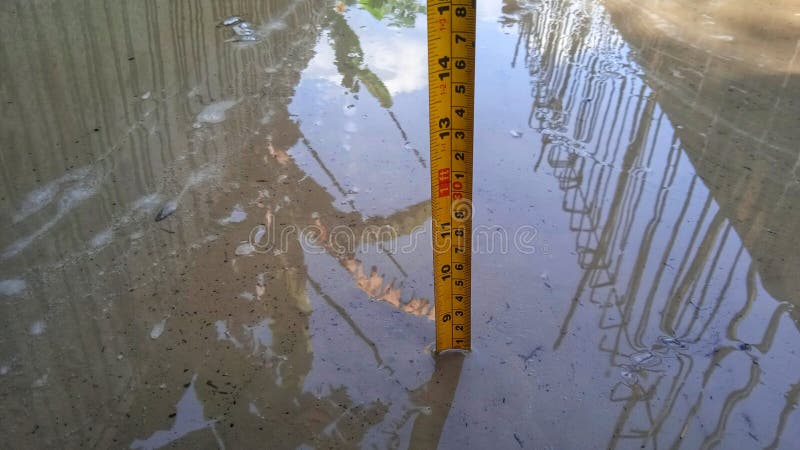 Measuring the Water Level in the Channel Using a Measuring Stick Stock ...