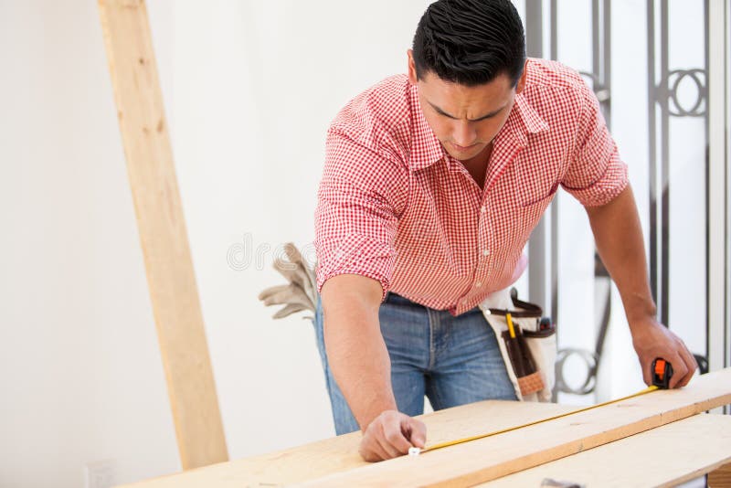 Measuring a wood board stock photo. Image of adult, wood - 41160040