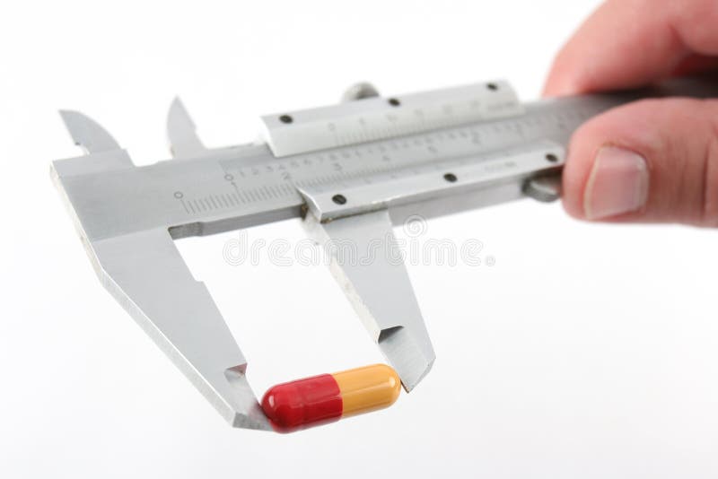 Measuring your dosage stock image. Image of measure, capsule - 608993