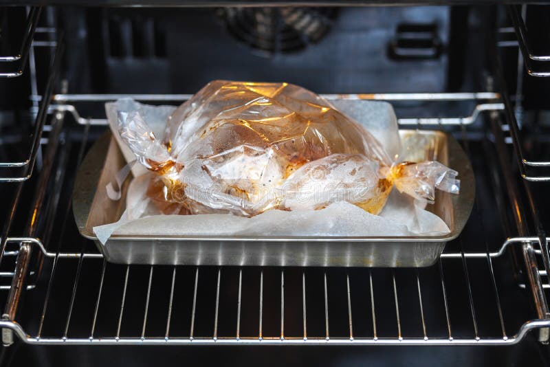 The Meat is Baked in the Sleeve in the Oven Stock Image - Image of ...