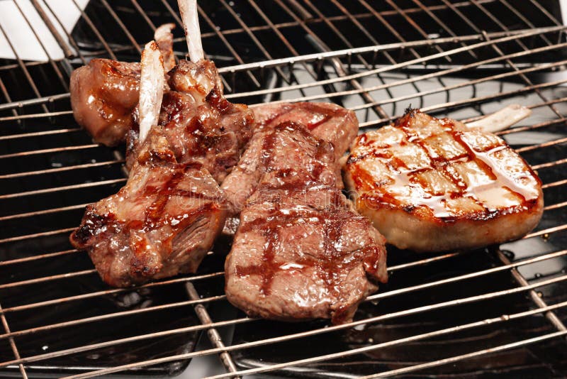 Meat with a Bone Cooked on the Grill with a Grill Rack Stock Image ...