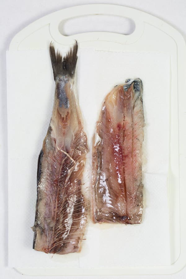 Meat and Bones of Fresh Herring for a Delicious Dish, Carve Fish Stock ...