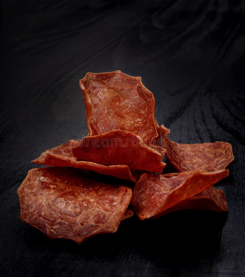 Meat Chips on a Black Background. Beautiful Placer of Thin Slices of ...