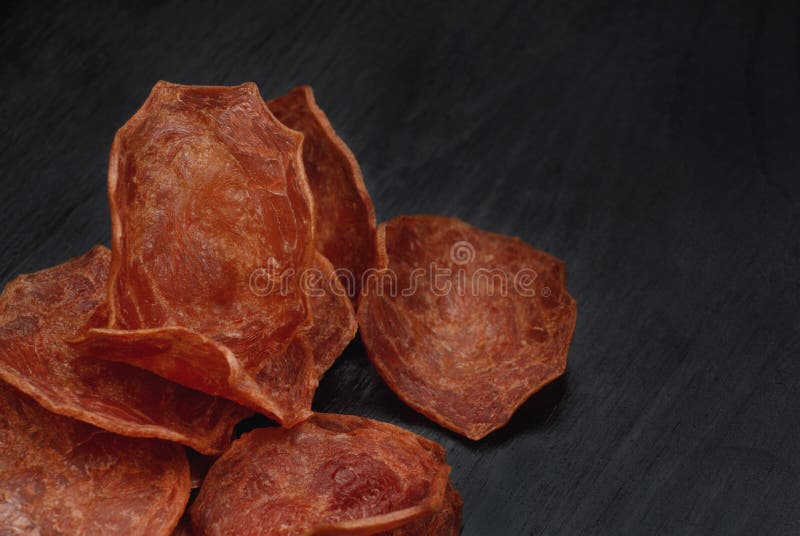 Meat Chips on a Black Background. Beautiful Placer of Thin Slices of ...