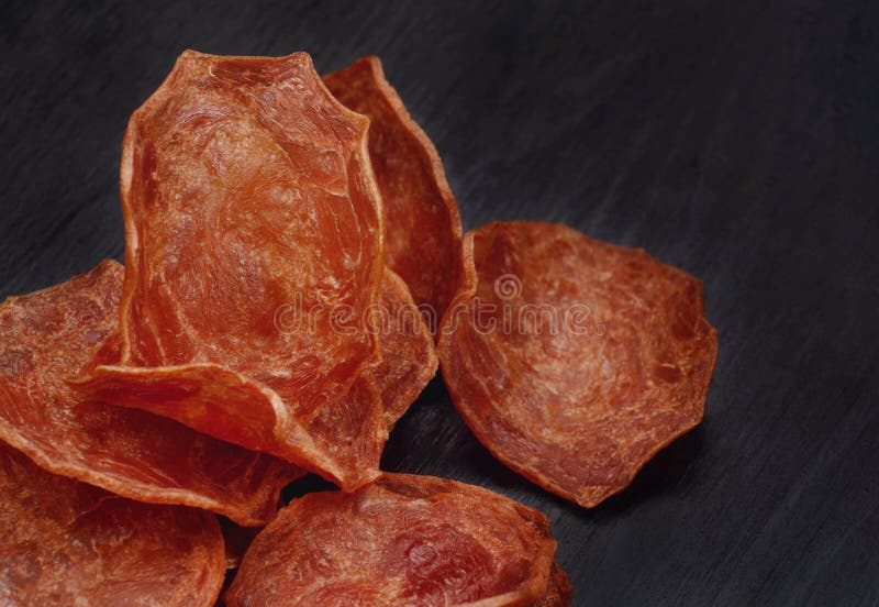 Meat Chips on a Black Background. Beautiful Placer of Thin Slices of ...
