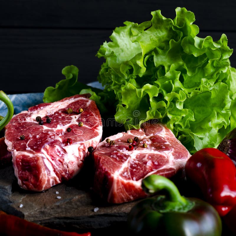 Meat Concept. Meat Steaks are Ready To Cook with Vegetables Lying on ...