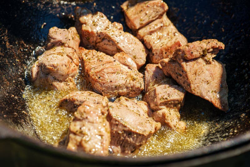 Meat is Cooked in Cauldron on Fire. Stock Photo - Image of iron ...