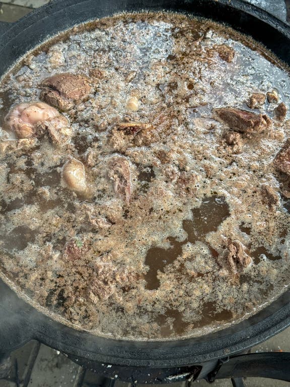 The Meat is Cooked in a Cauldron Over a Fire Stock Photo - Image of ...