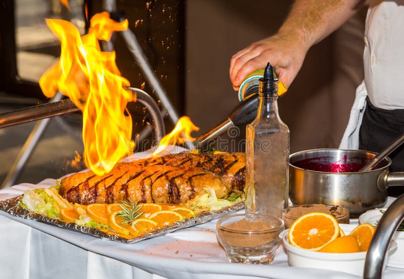 Meat dish with mini-torch stock photo. Image of festive - 121259926